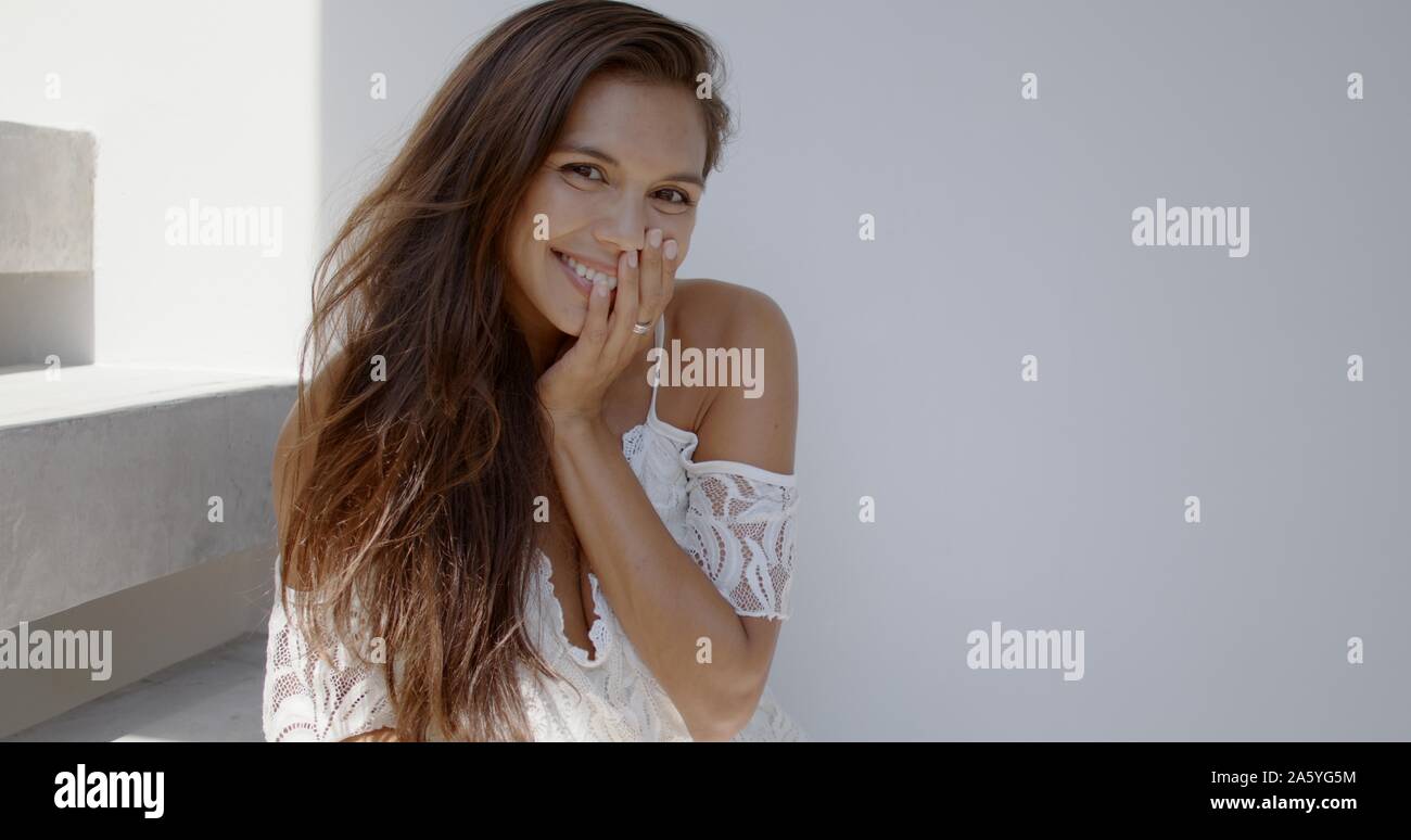 Happy embarrassed young woman hi-res stock photography and images - Alamy