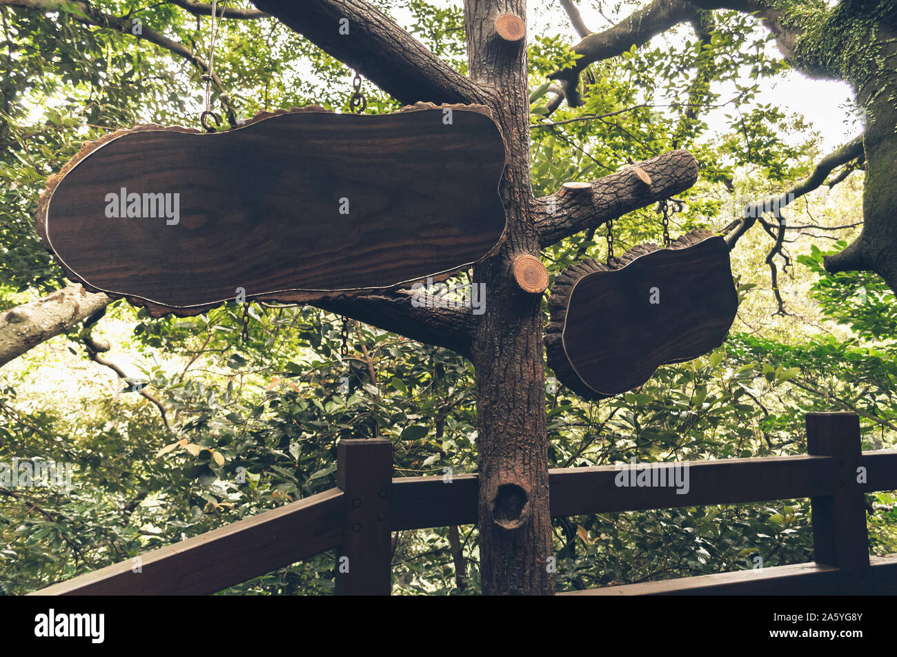 wooden sign boards without text with green forest background Stock ...
