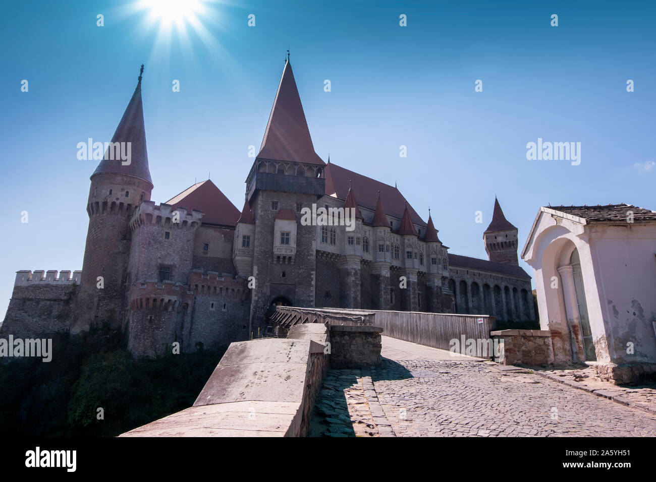Wide view of Corvin Castle or Hunyadi Castle in Hunedoara in bright ...