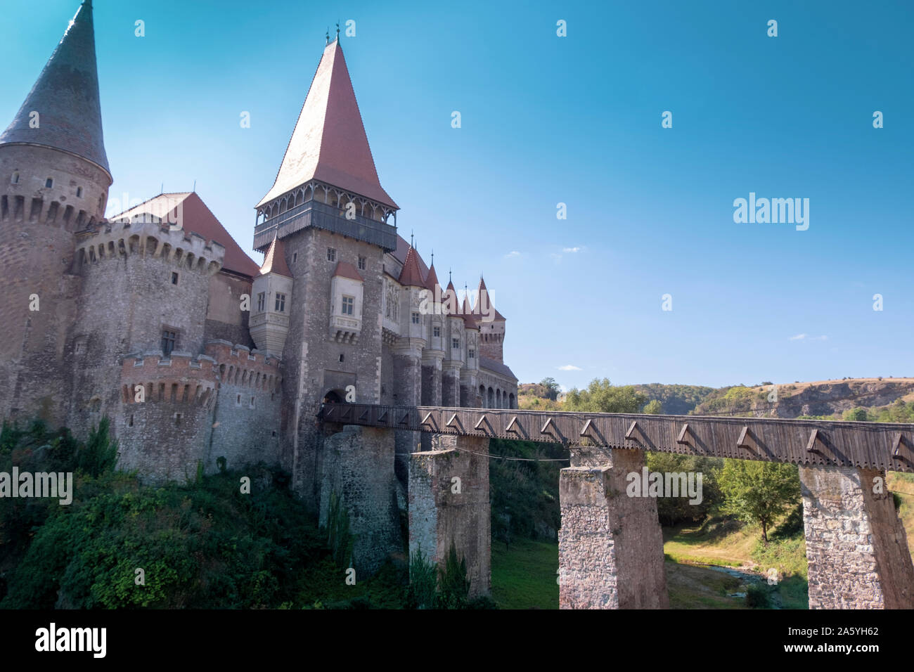 Wide view of Corvin Castle or Hunyadi Castle and bridge in Hunedoara in ...