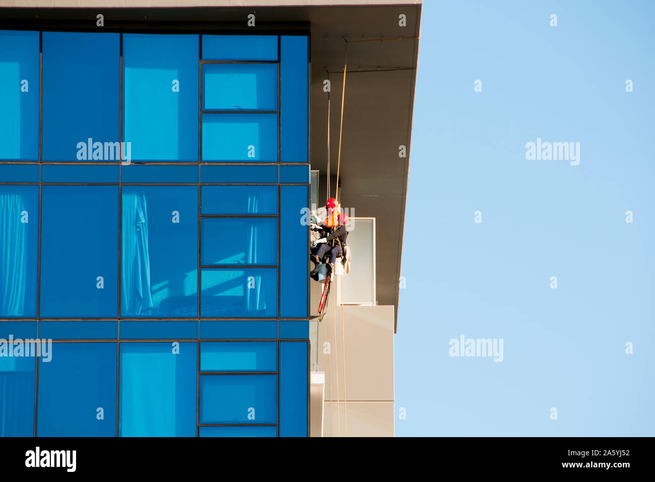 Windows Cleaning on City Building Stock Photo - Alamy