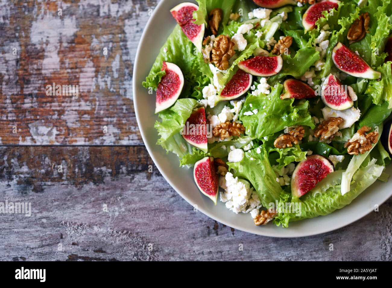 Green salad with figs and white cheese. Keto salad. Keto diet Stock ...