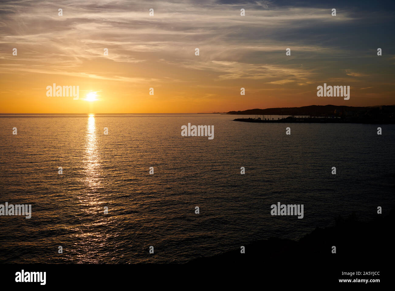 Sunset over the sea Stock Photo - Alamy