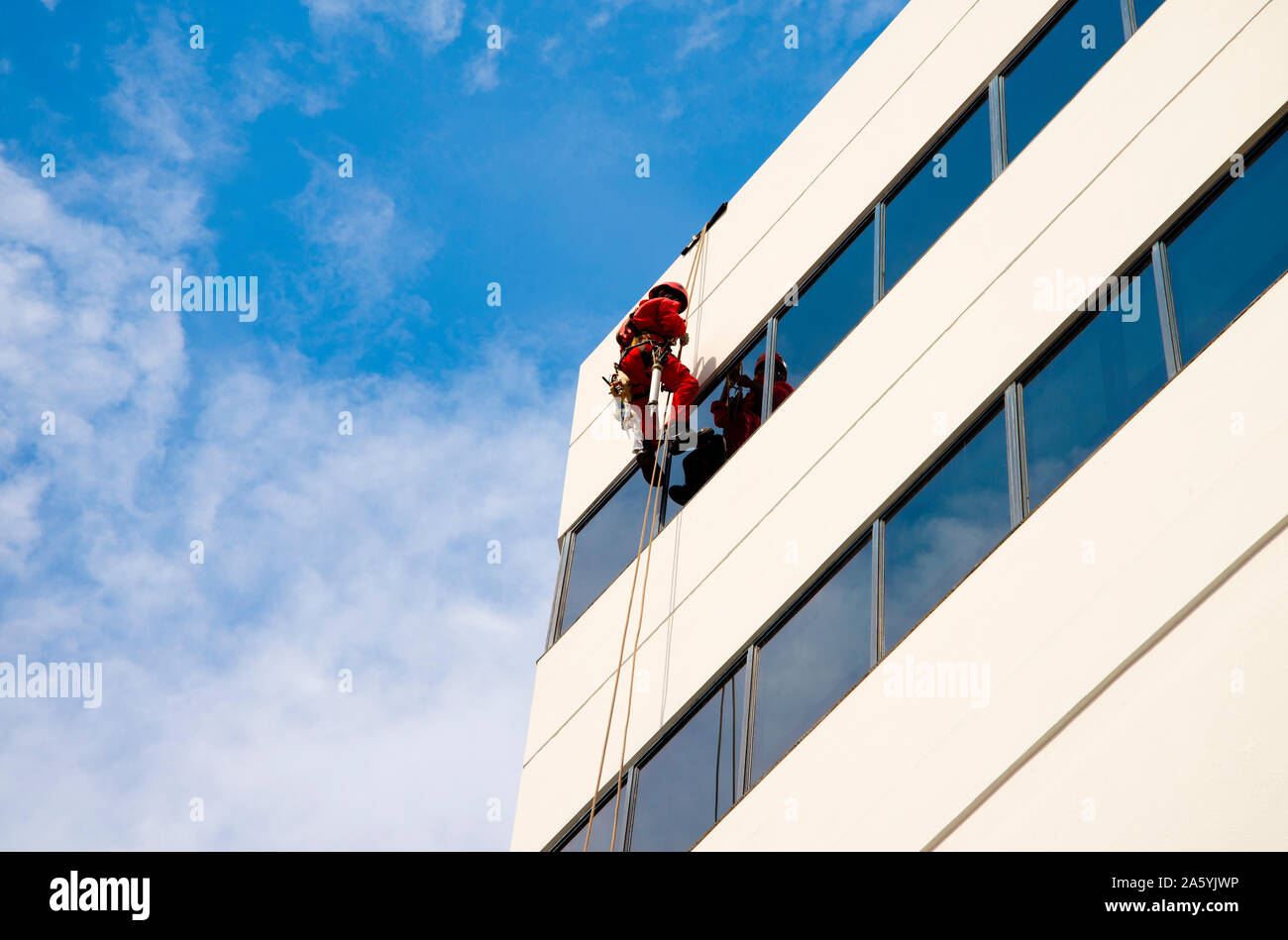 Windows Cleaning on City Building Stock Photo - Alamy