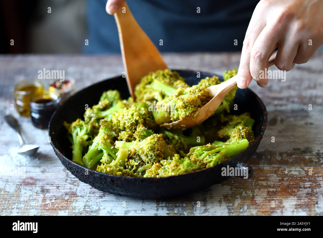 Chef mixes broccoli in a pan. Cooking broccoli. Healthy food Stock ...