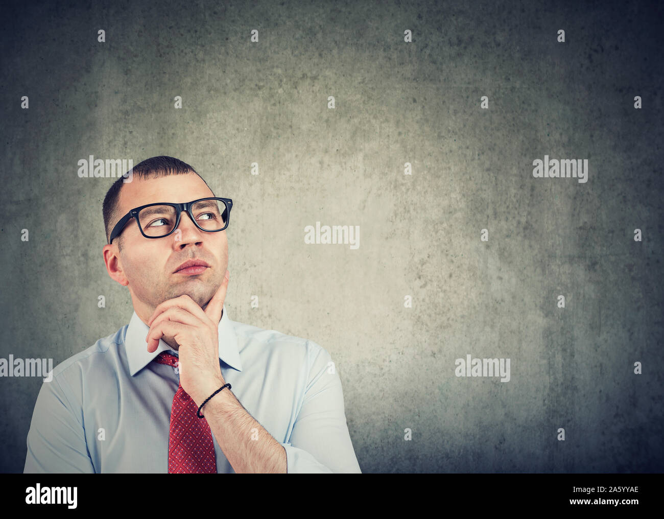 Business man thoughtful expression hi-res stock photography and images ...