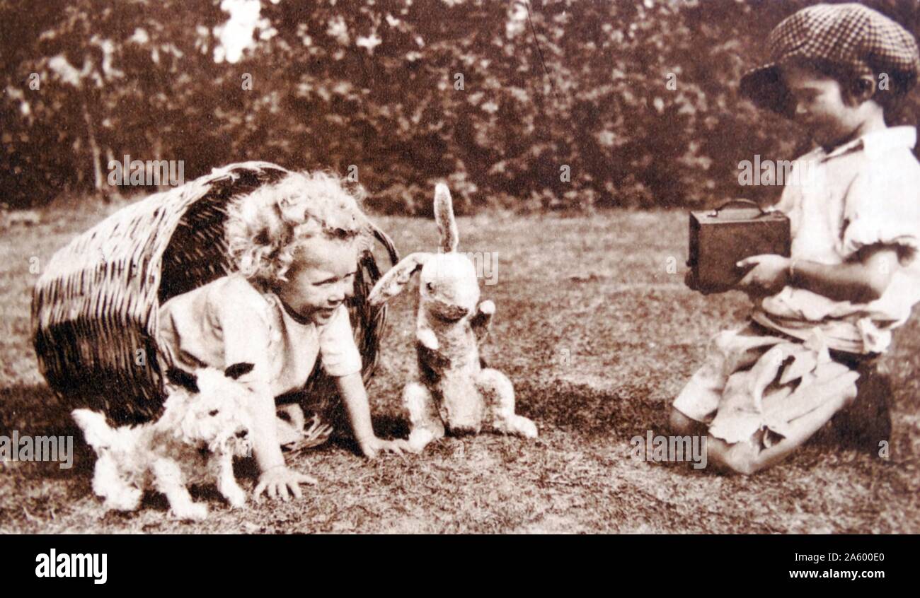 Vintage photograph of two children playing with toys in an English ...