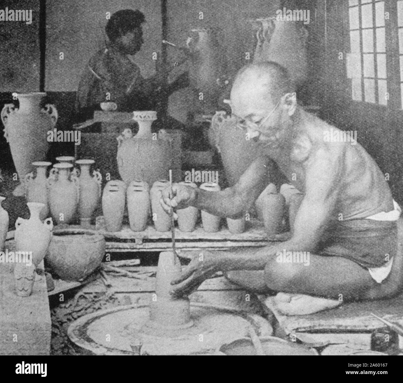 Japanese potter painting a vase; Japan 1880 Stock Photo - Alamy