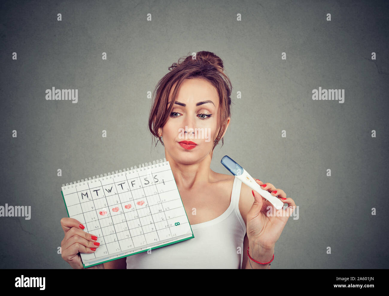 Woman and calendar and confused hi-res stock photography and images - Alamy