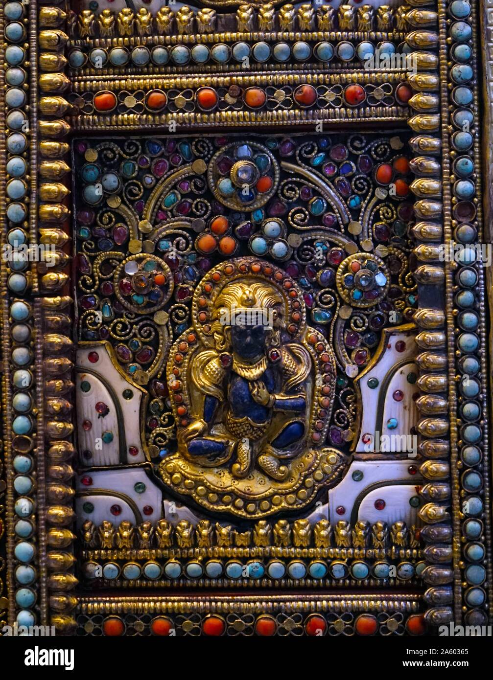 Altar screen of metal, set with bone, shell, precious and semi-precious ...