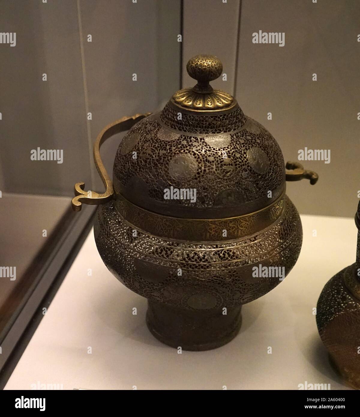 patinated brass vessel in openwork with cast handles, from Iran. Dated ...