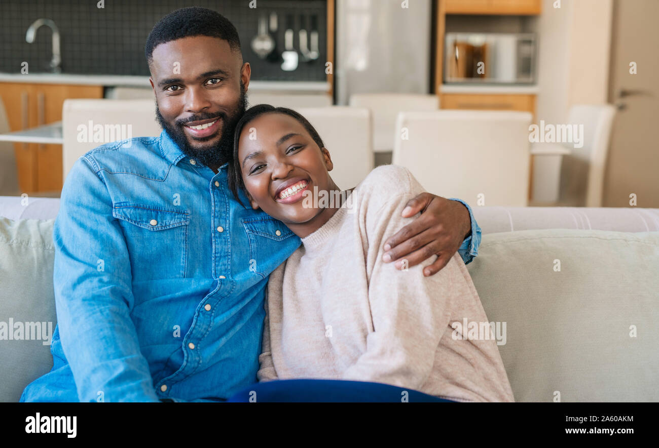 Black couple sitting side by side hi-res stock photography and images ...