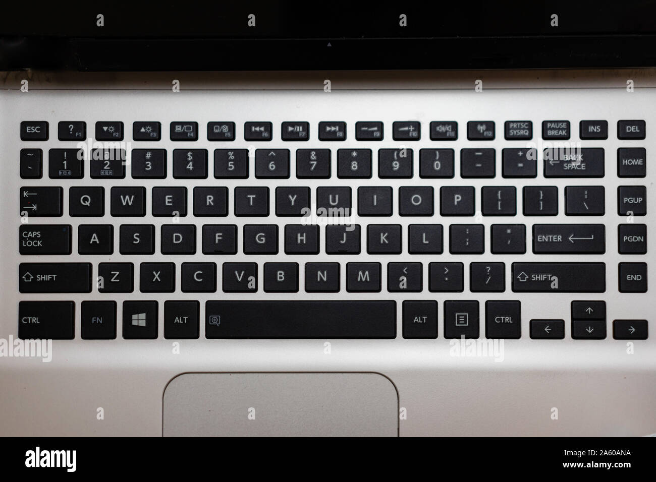 Laptop on black office desk. Laptop Keyboard close up Stock Photo - Alamy