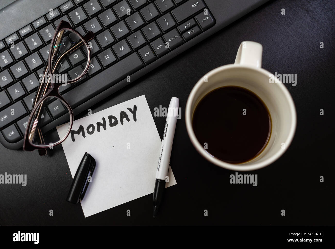 Different objects on black office desk. Modern black office desk table ...