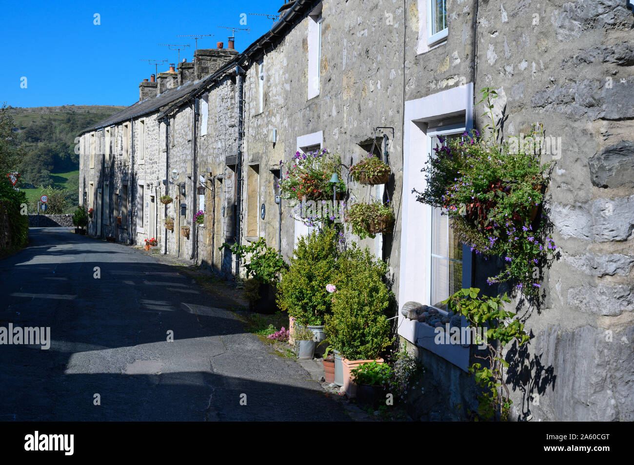 Terraced country cottages on a summers day in the village of Langcliffe ...