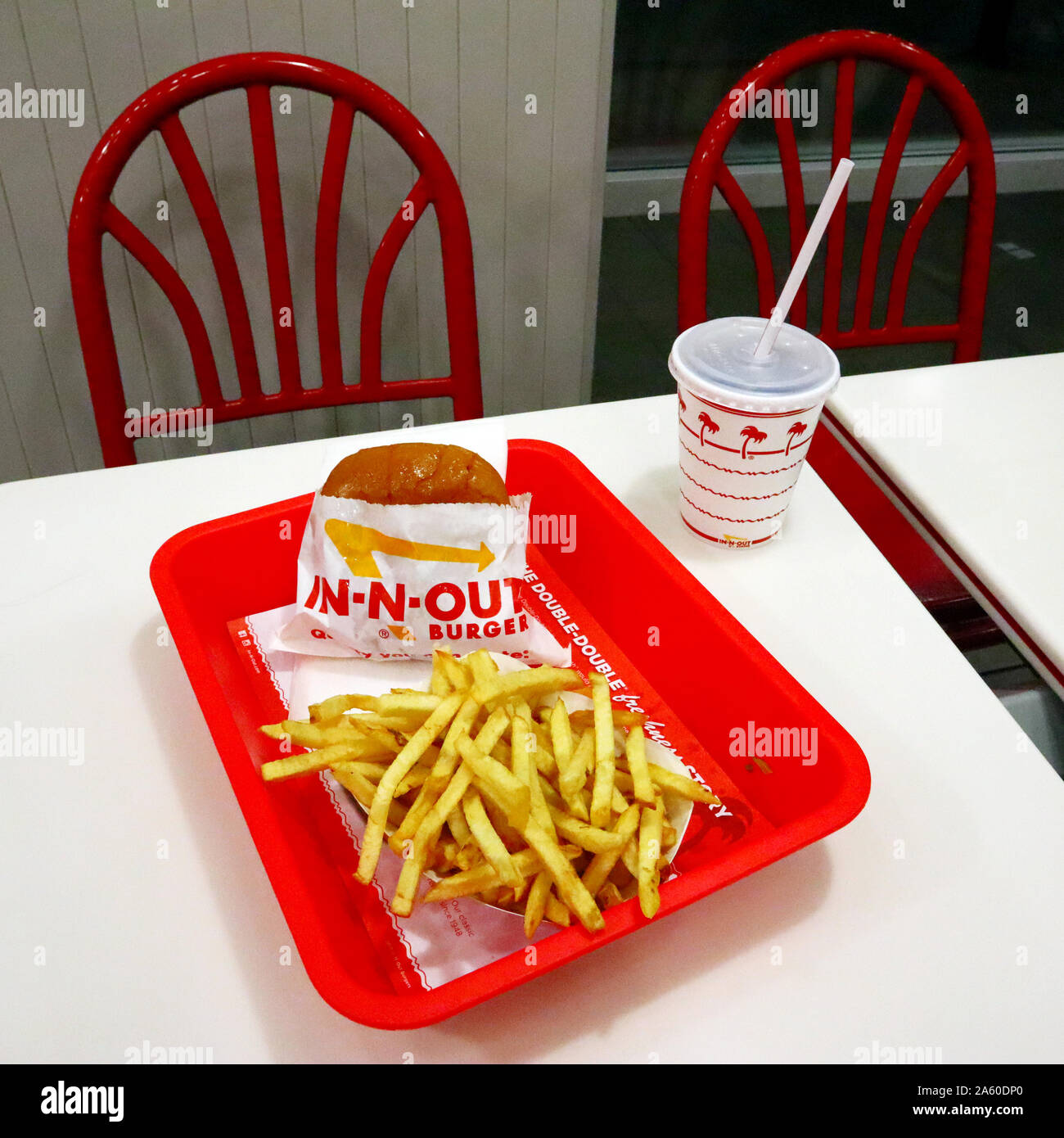 IN-N-OUT Burger - Hamburger and french fries in a tray on the table ...
