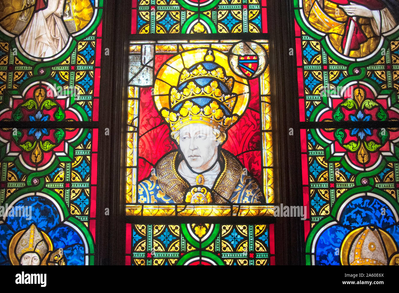 A stained glass window depicting saints within the historic marble ...