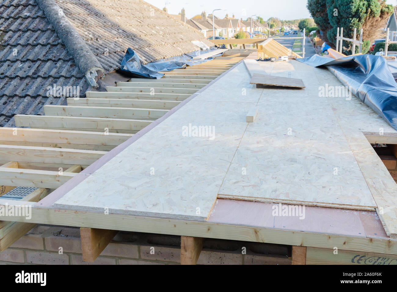 Unfinished roof structure, renovation Stock Photo - Alamy