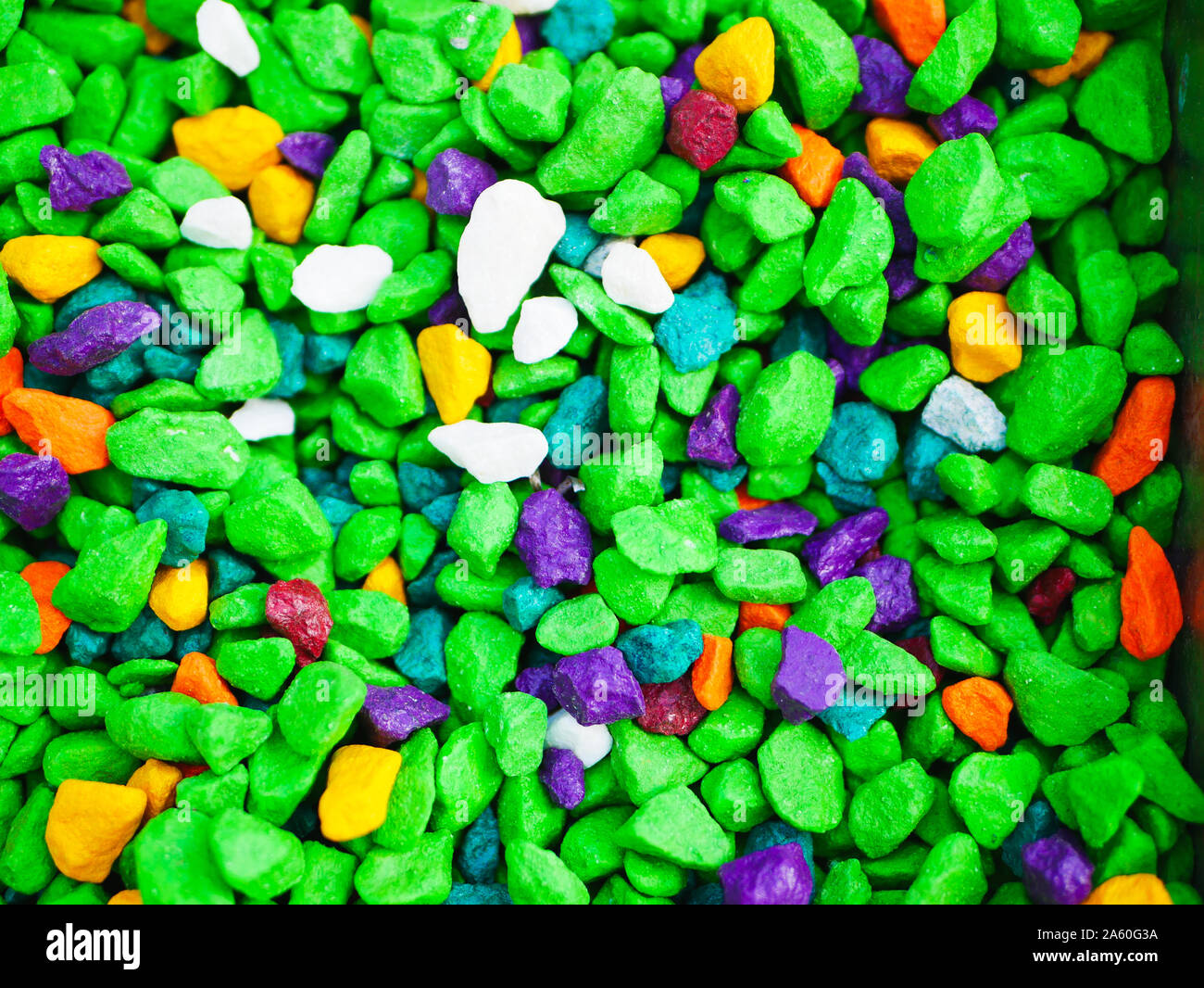 green little pebbles. The background consists of small green pebbles ...