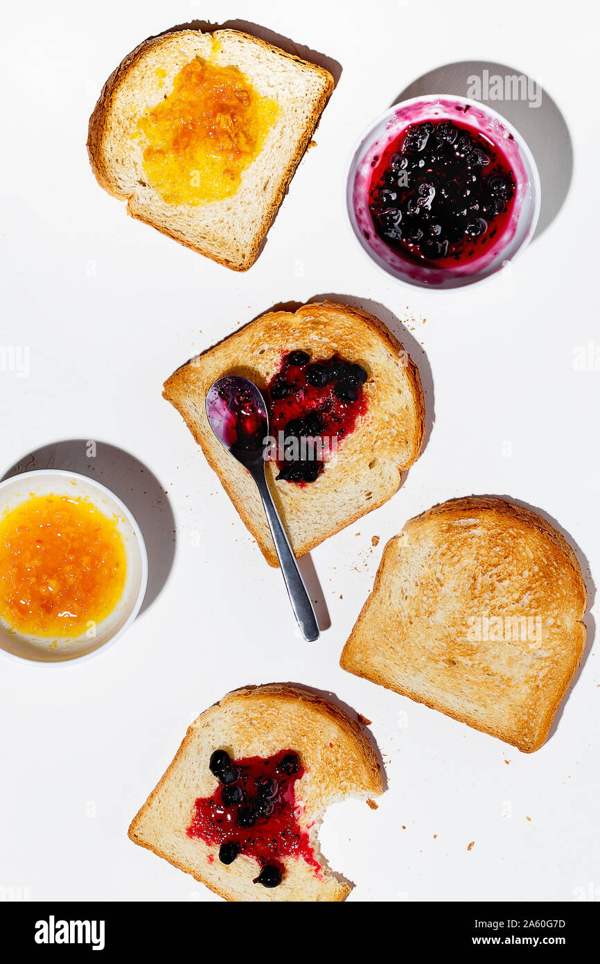 Creative set of toasted bread with tasty different jam isolated on a ...