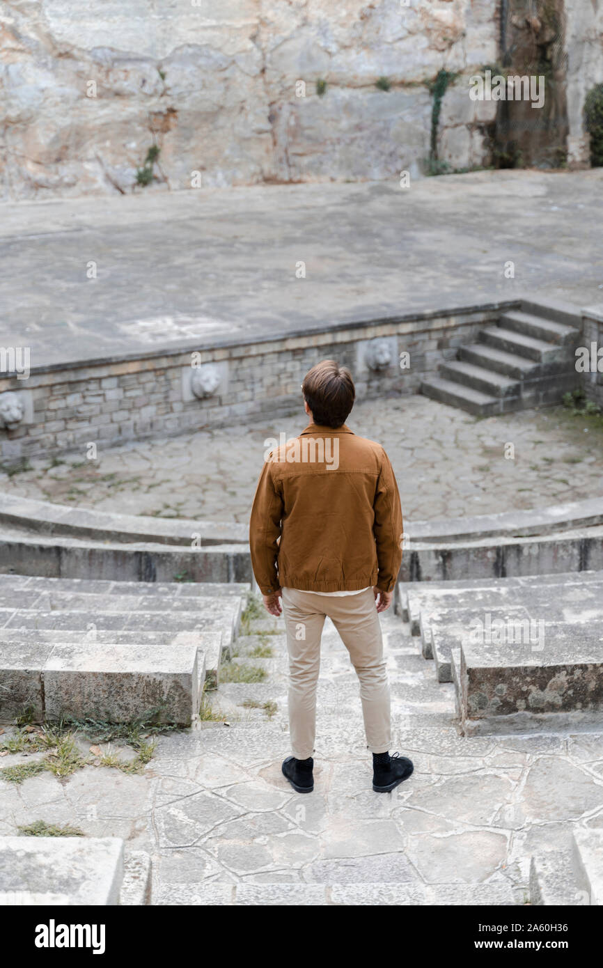 Back view of man watching amphitheatre hi-res stock photography and ...