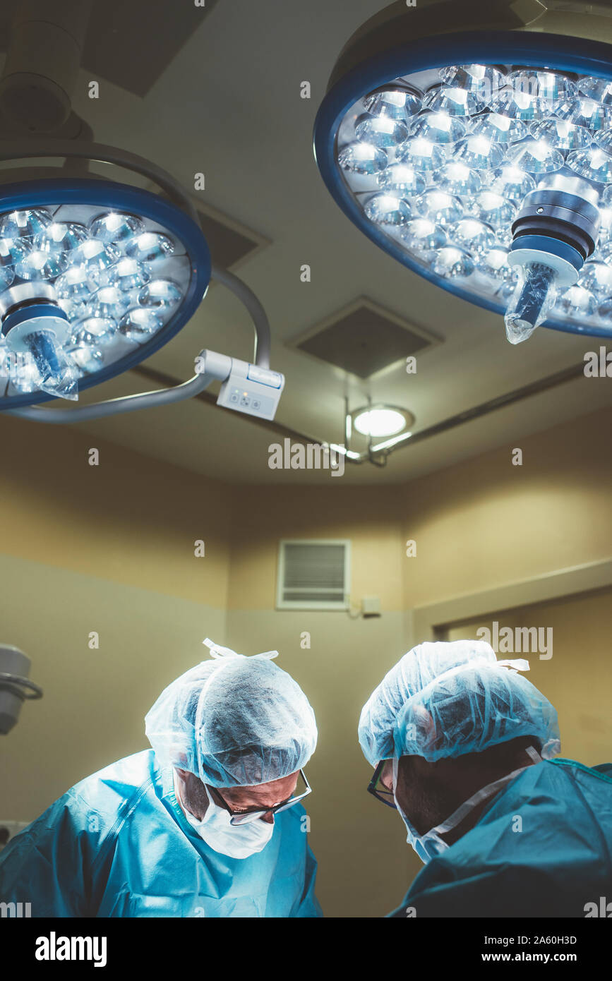 Surgeons during a surgery Stock Photo - Alamy