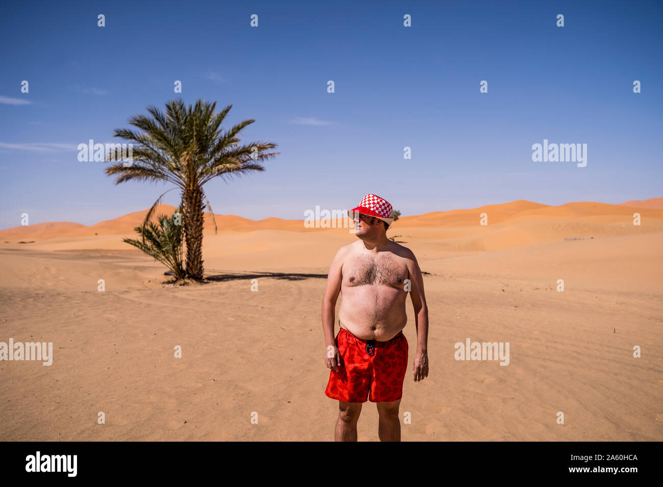 Man Standing Alone In Desert