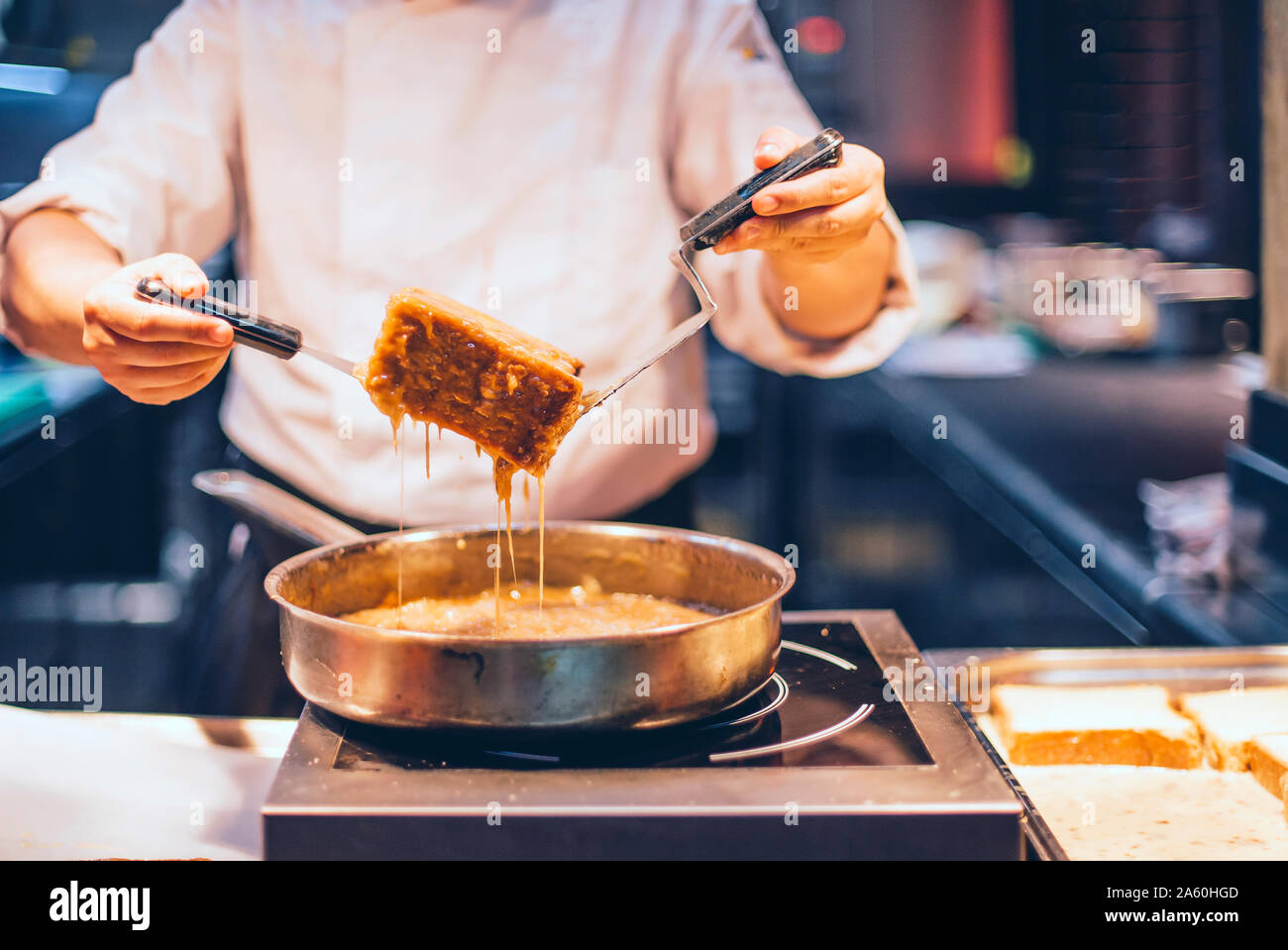 Chef creating a cake in the kitchen of a restaurant Stock Photo - Alamy