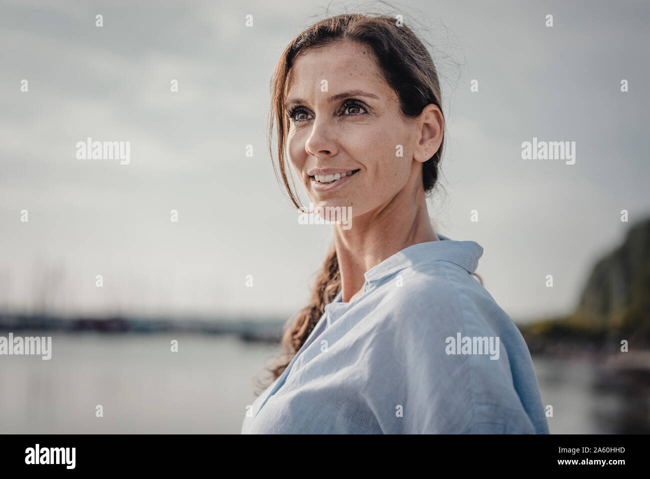 Portrait of a beautiful woman at the sea Stock Photo - Alamy