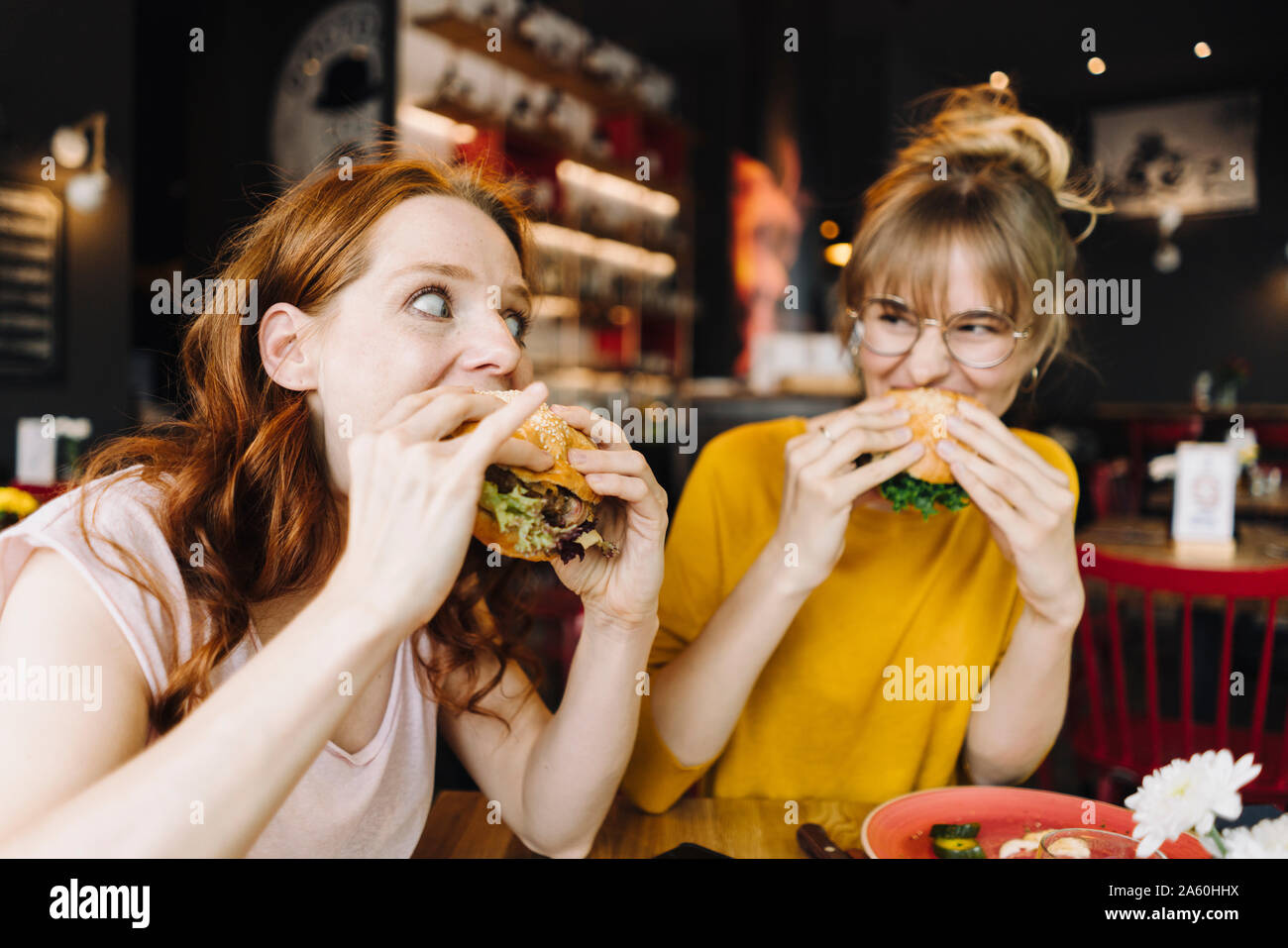 Two women eating in restaurant hi-res stock photography and images - Alamy