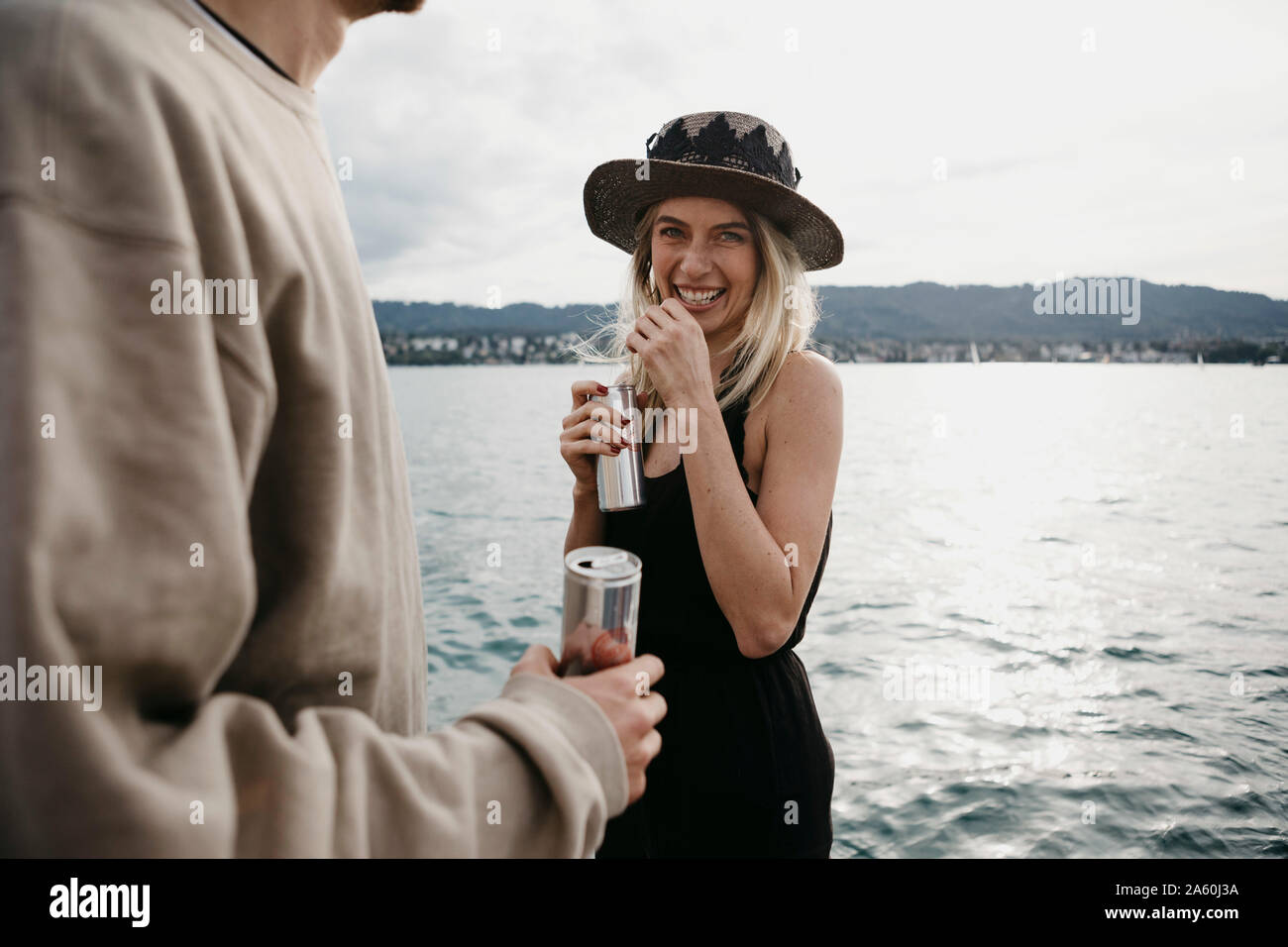 Young man drinking beer at a lake hi-res stock photography and images ...