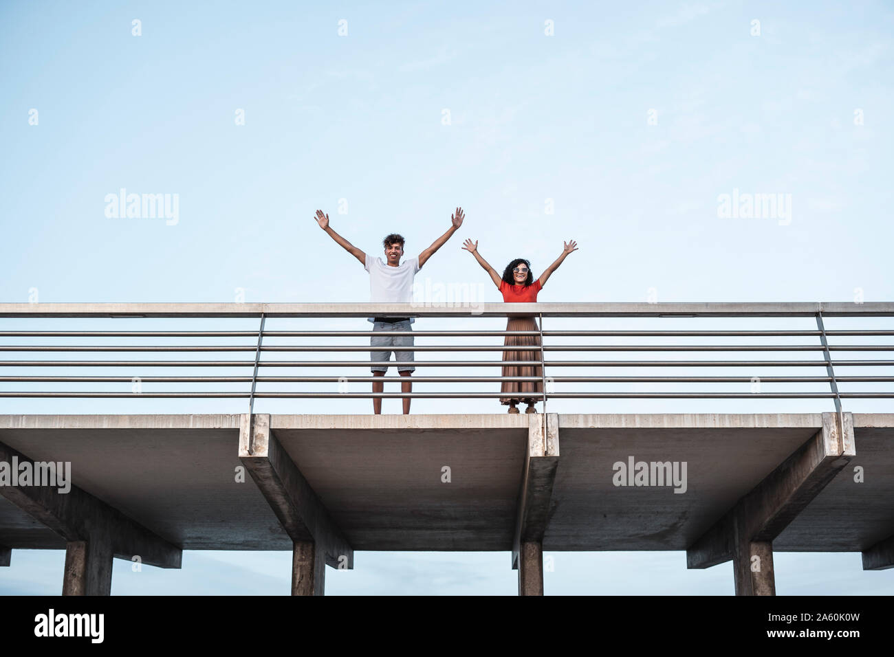 Two women standing on bridge hi-res stock photography and images - Alamy
