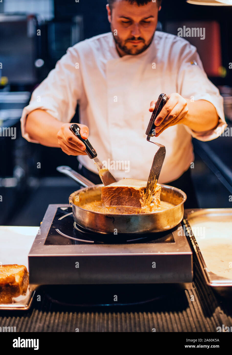 Chef creating a cake in the kitchen of a restaurant Stock Photo - Alamy
