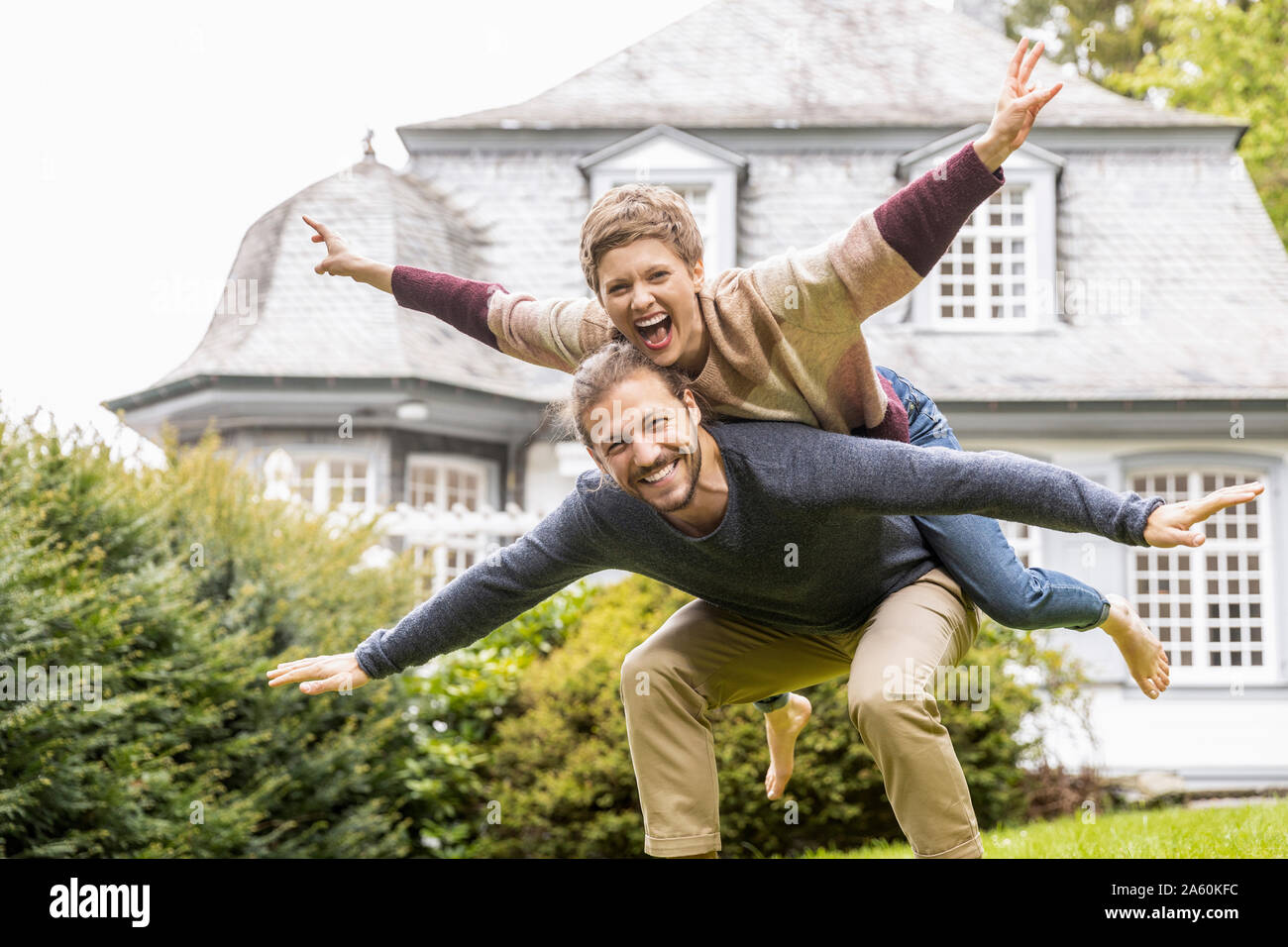 Couple in garden arms hi-res stock photography and images - Alamy