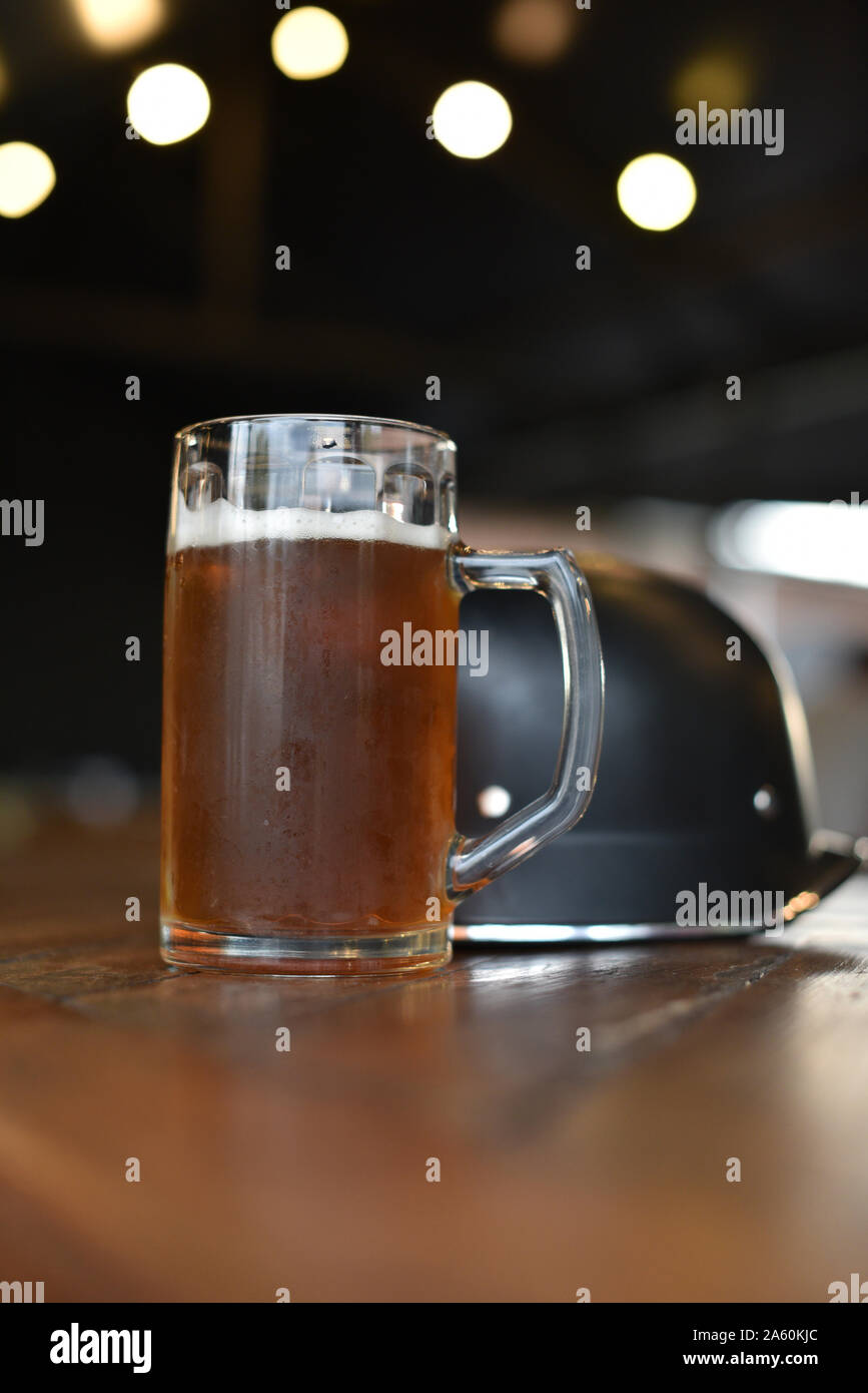 Glass of beer on wooden table. Beer in a glass. Beer in a glass at a ...