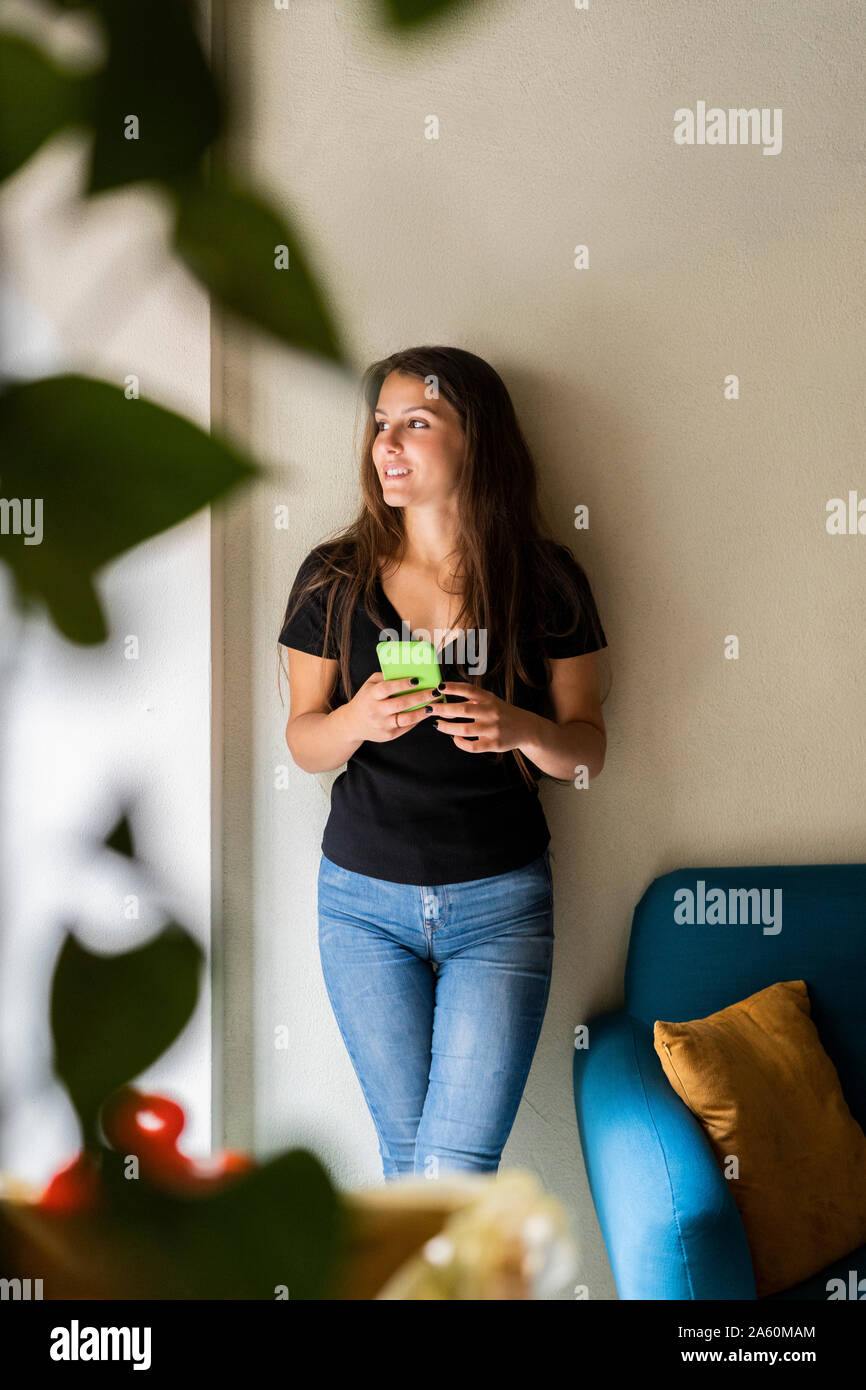 Leaning against the couch hi-res stock photography and images - Alamy