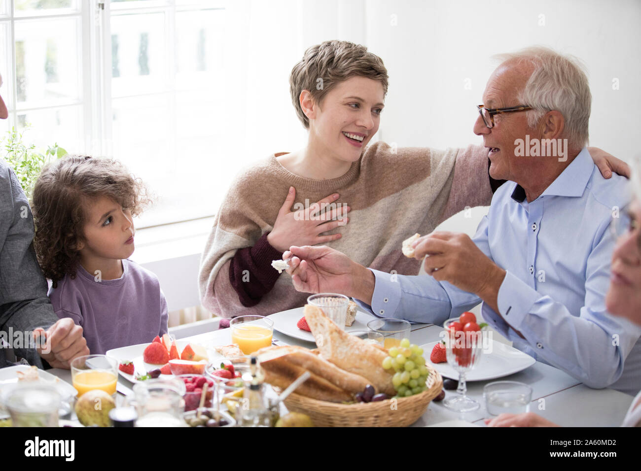 Happy extended family having lunch at home Stock Photo - Alamy