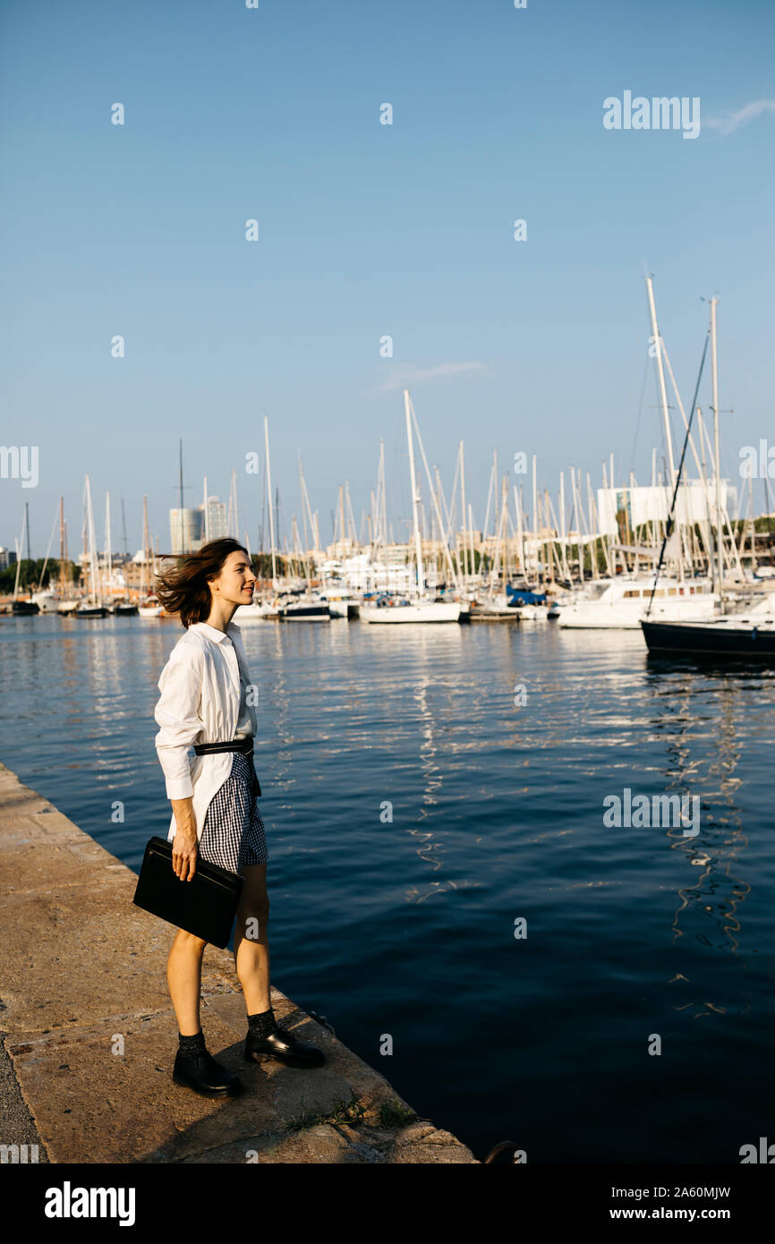 Woman watching boats hi-res stock photography and images - Alamy