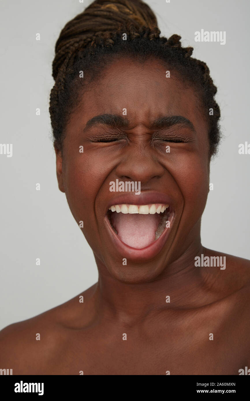 Portrait of African woman, screaming Stock Photo - Alamy