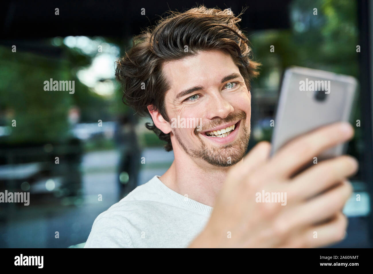 Portrait happy man phone hi-res stock photography and images - Alamy