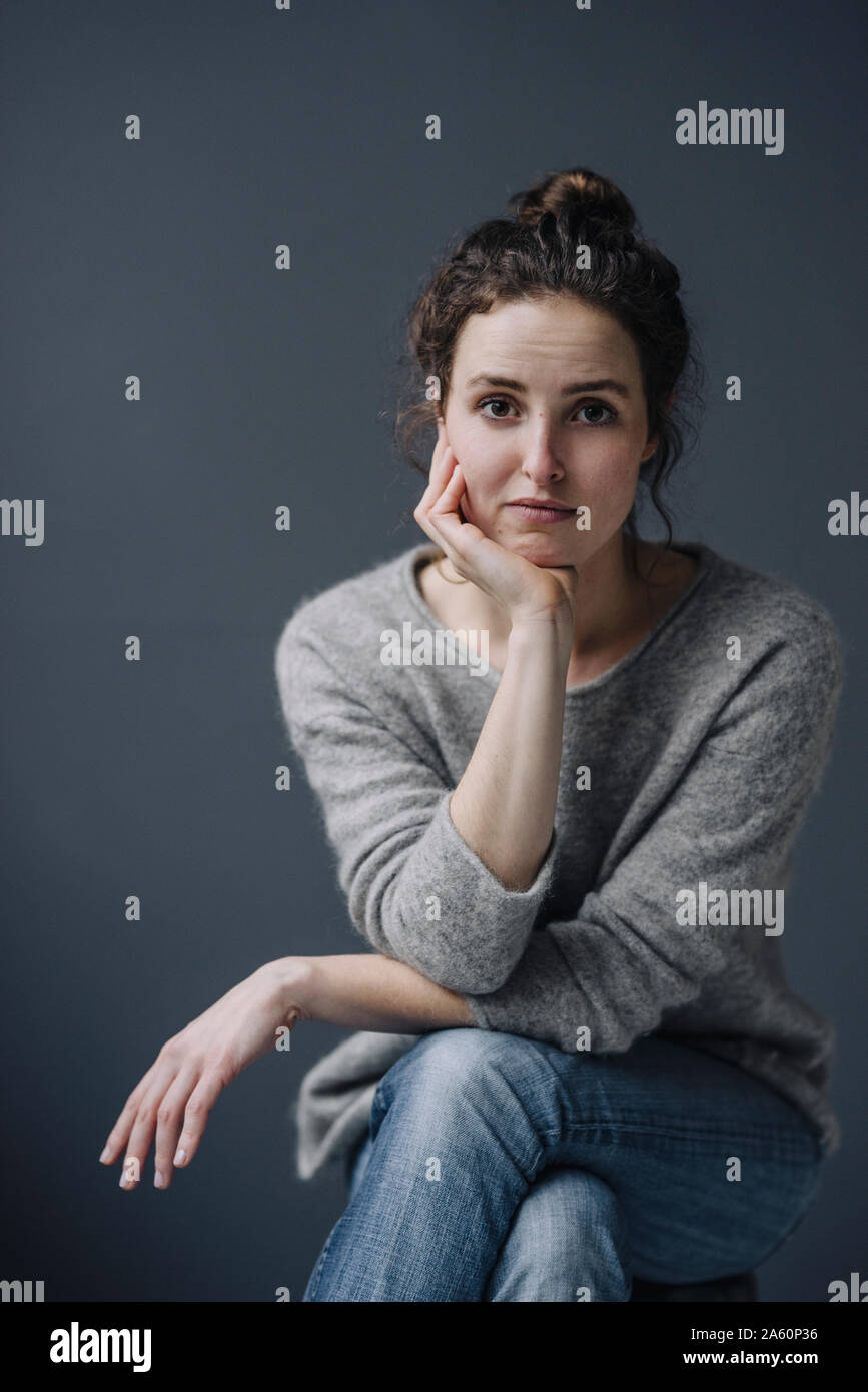 Portrait of pensive young woman Stock Photo - Alamy