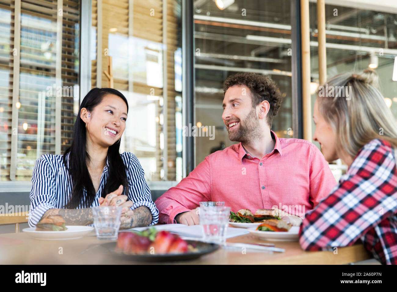 Friends having casual meeting cafe hi-res stock photography and images ...