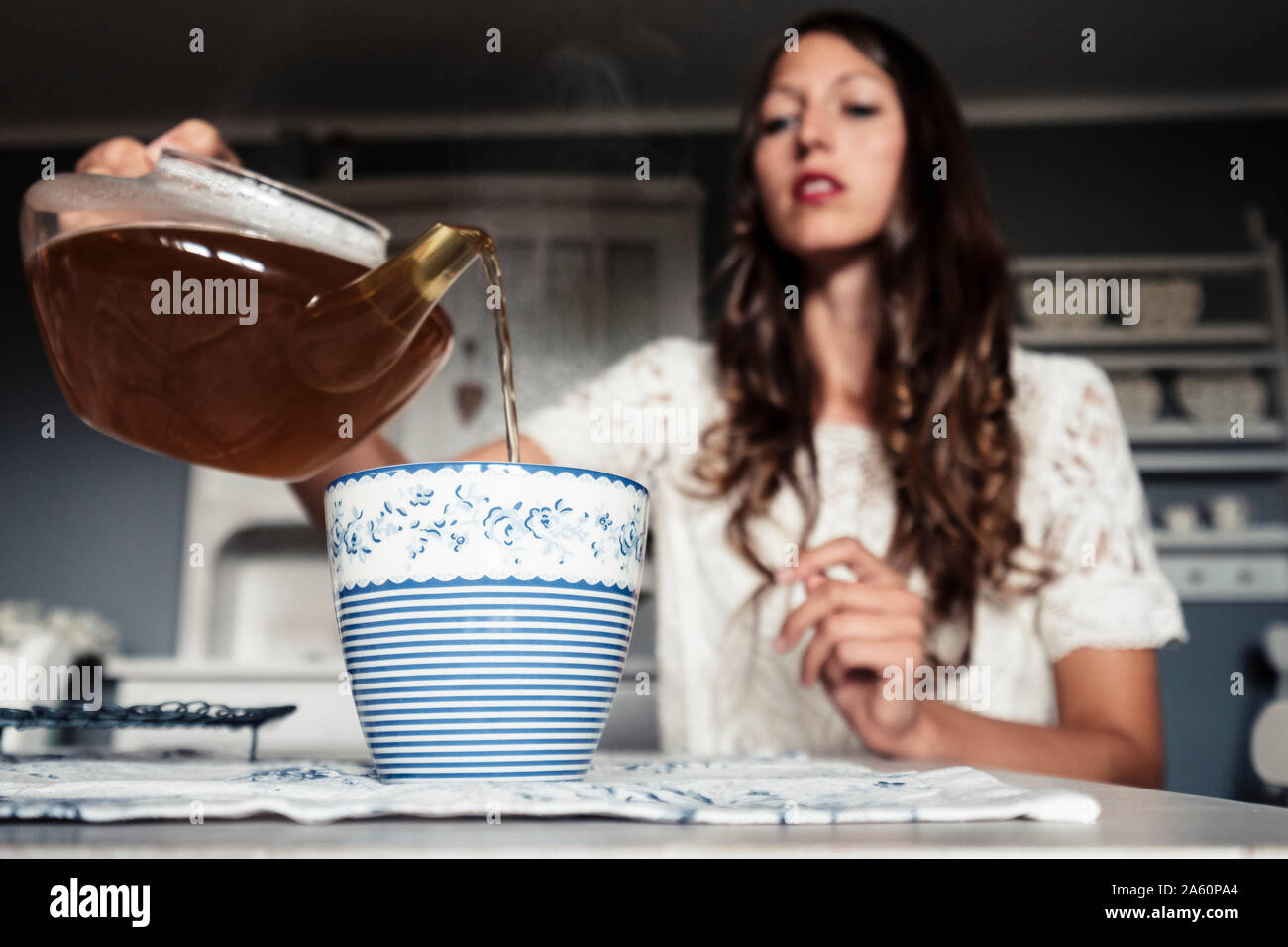 Young caucasian woman pouring tea hi-res stock photography and images ...