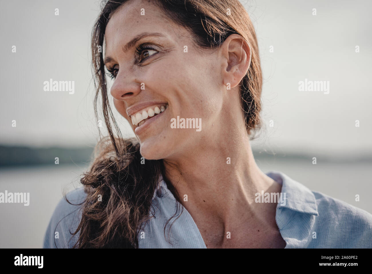 Portrait of a beautiful woman at the sea Stock Photo - Alamy