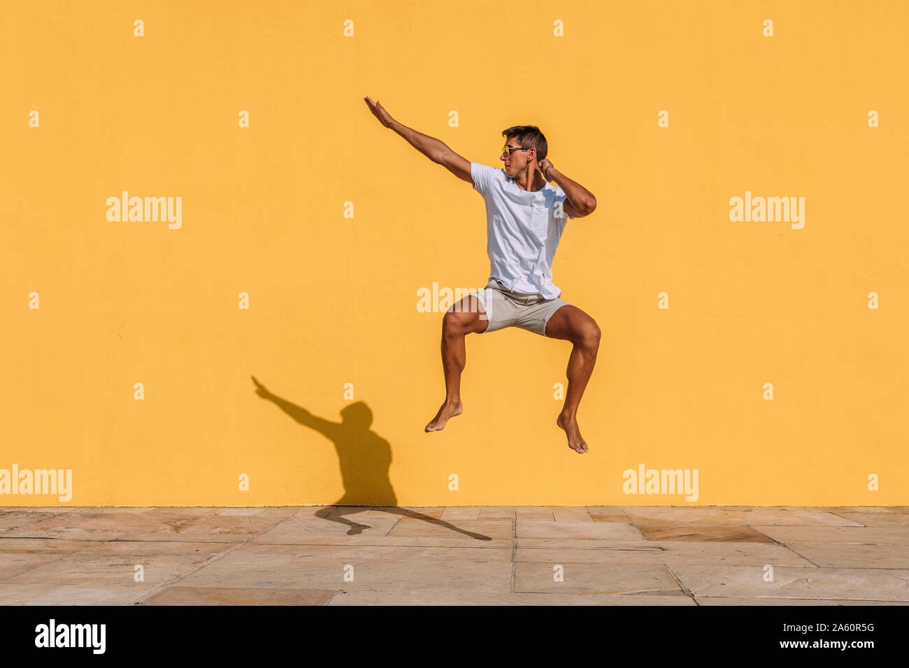 Joyful man in yellow hi-res stock photography and images - Alamy