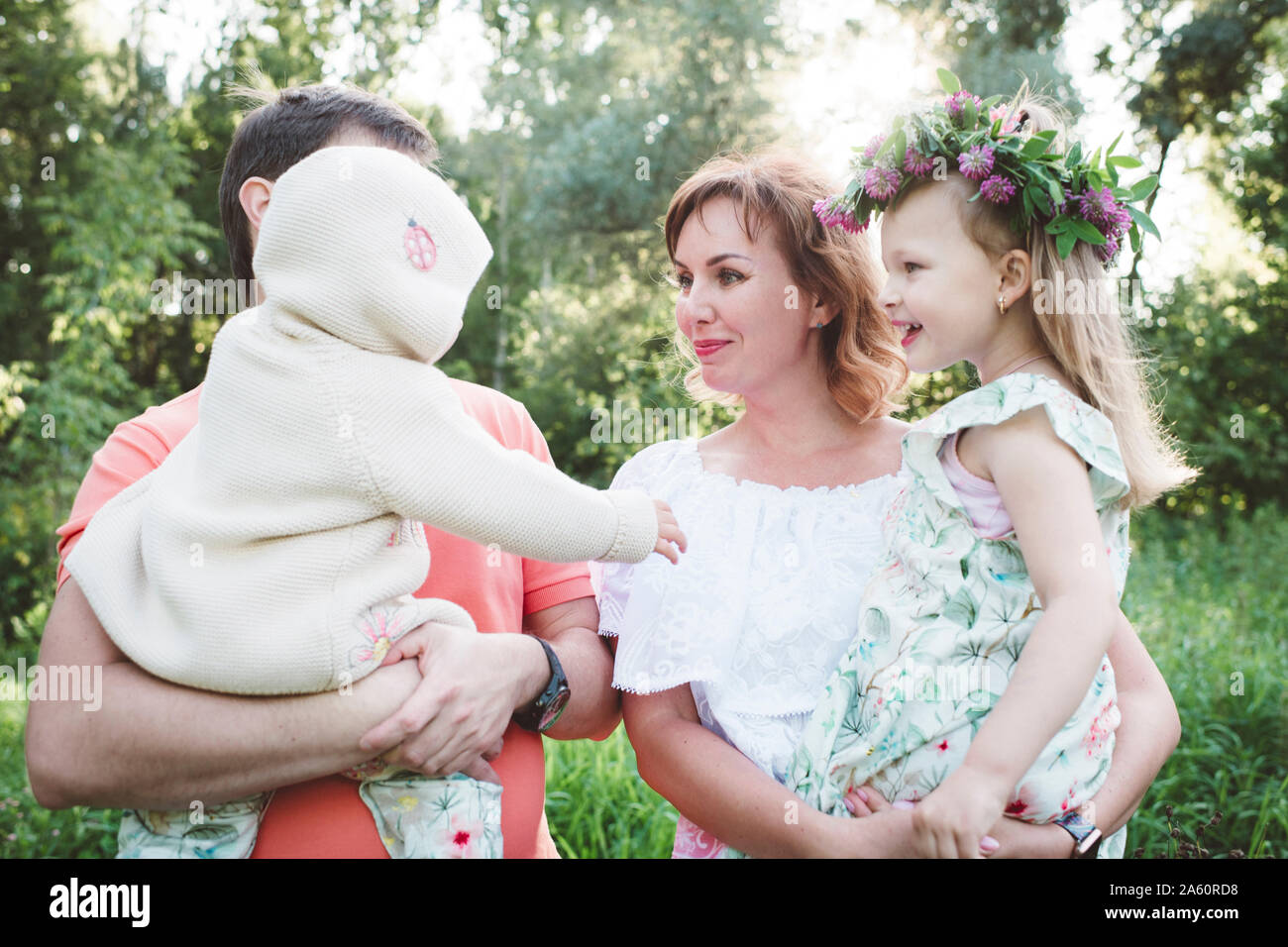 Parents with two daughters in nature Stock Photo - Alamy