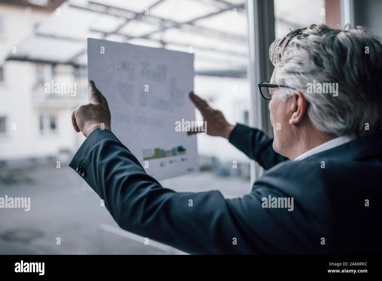 Person looking paper hi-res stock photography and images - Alamy