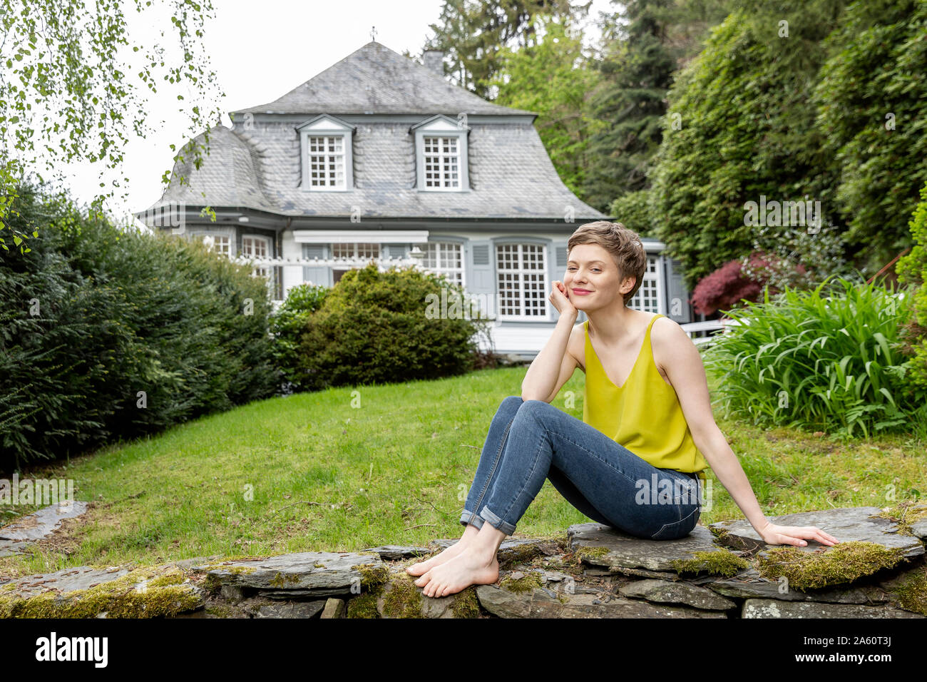 Relaxed woman in jeans hi-res stock photography and images - Alamy