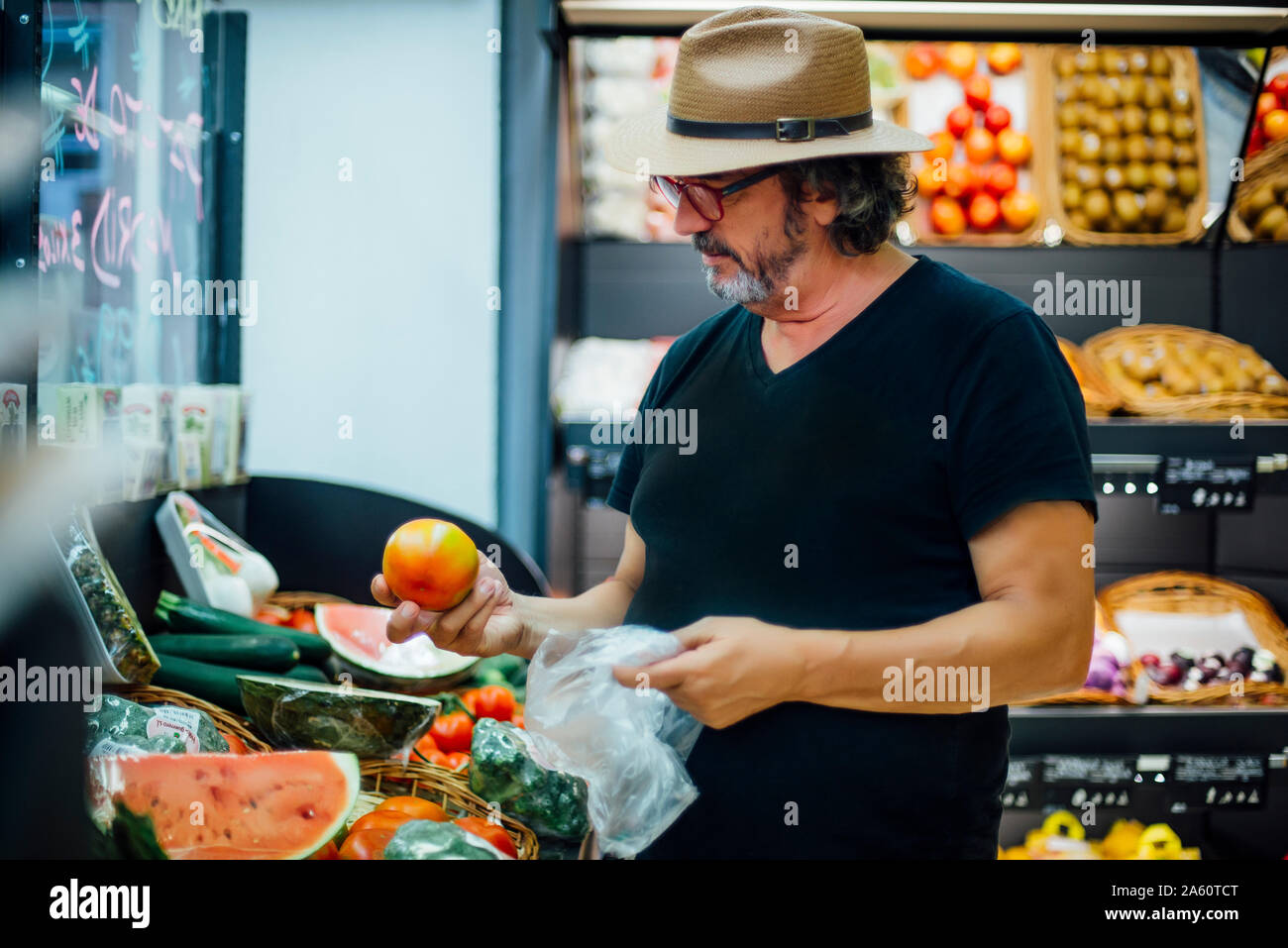 Senior man buying food in a supermarket Stock Photo - Alamy
