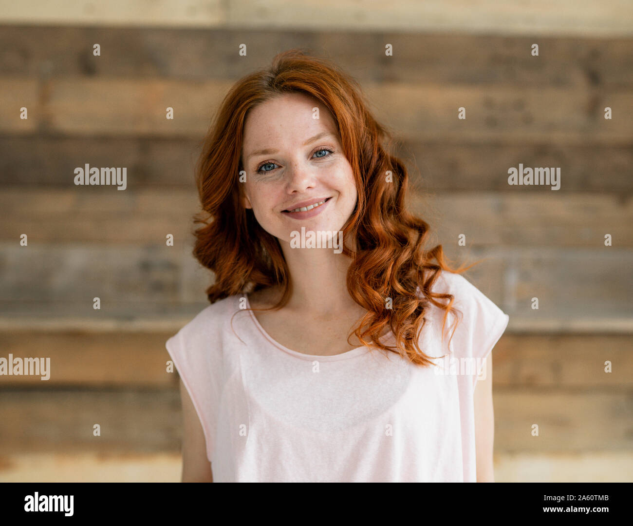 Portrait of smiling redheaded woman Stock Photo - Alamy